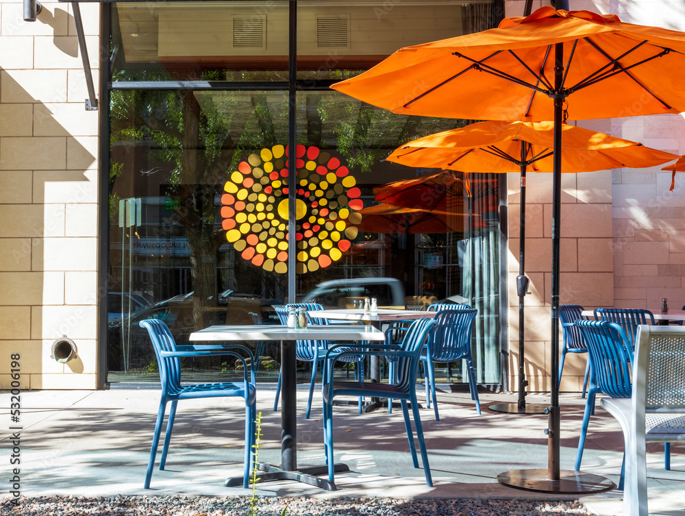 Empty cafe with tables and chairs. Street exterior of a restaurant in ...