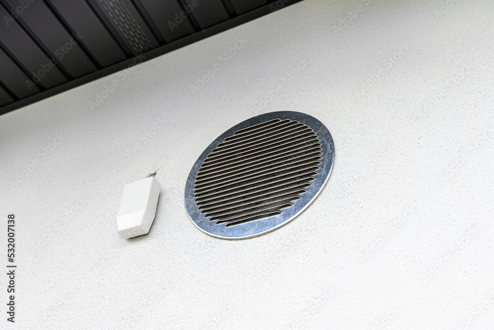 Air intake and exhaust in the wall of a single family house for ...