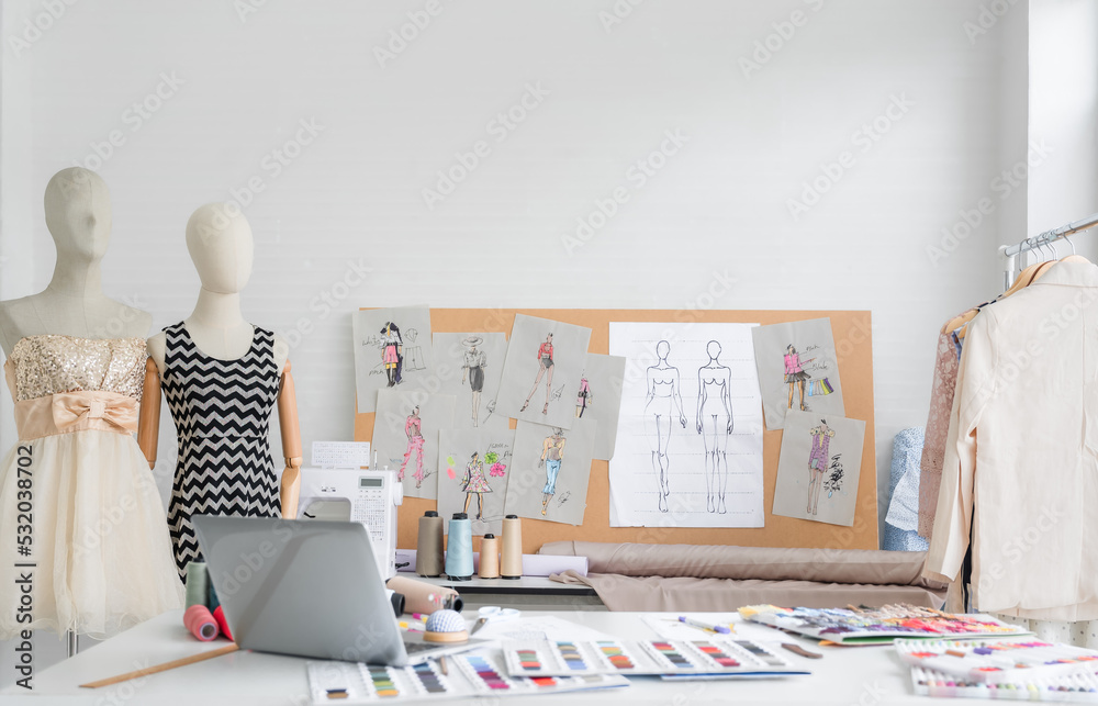 Workplace of dressmaker and designer seamstress tailor with the dummy ...