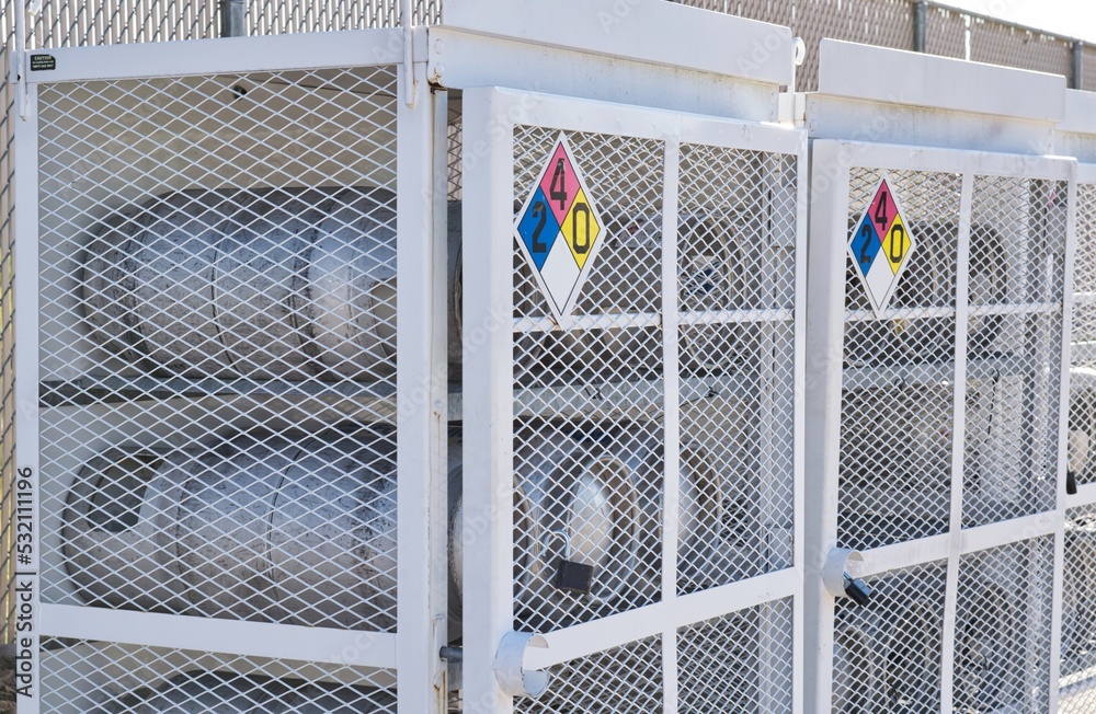 Liquid Petroleum gas cylinders stored horizontally in metal safety ...