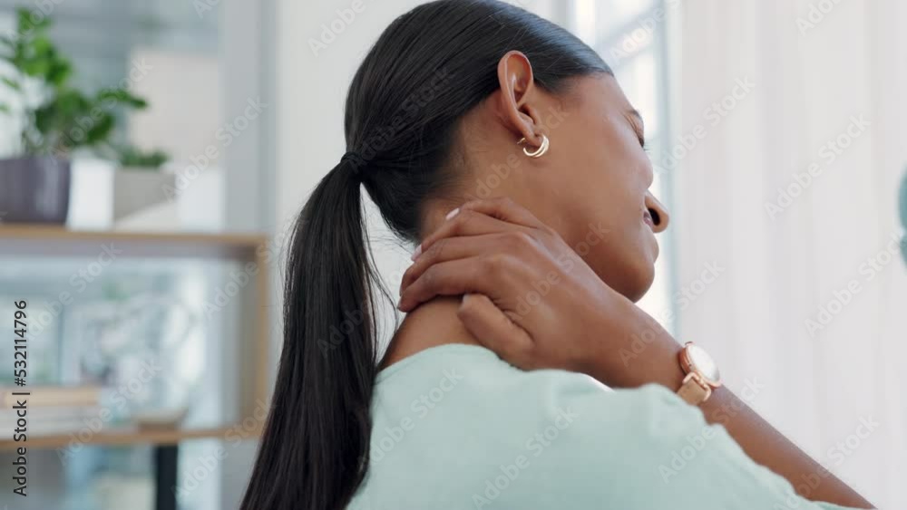 Woman working on computer, has neck pain in office or home while doing ...
