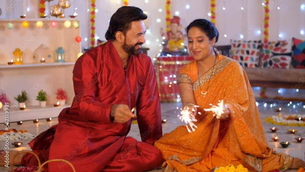 Diwali Celebration With Diwali Crackers Indian Couple Burning Sparklers During The Diwali