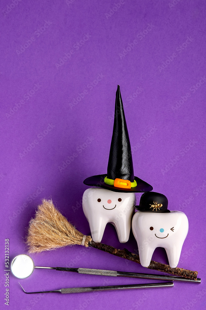 dental concept. figurines of teeth in halloween costumes and dental ...