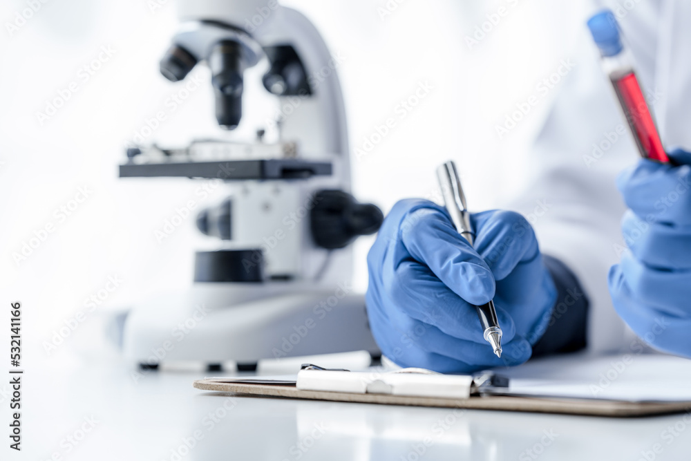 Laboratory and science experiments, chemical hand taking a blood sample ...