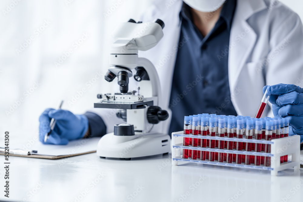 Laboratory and science experiments, chemical hand taking a blood sample ...