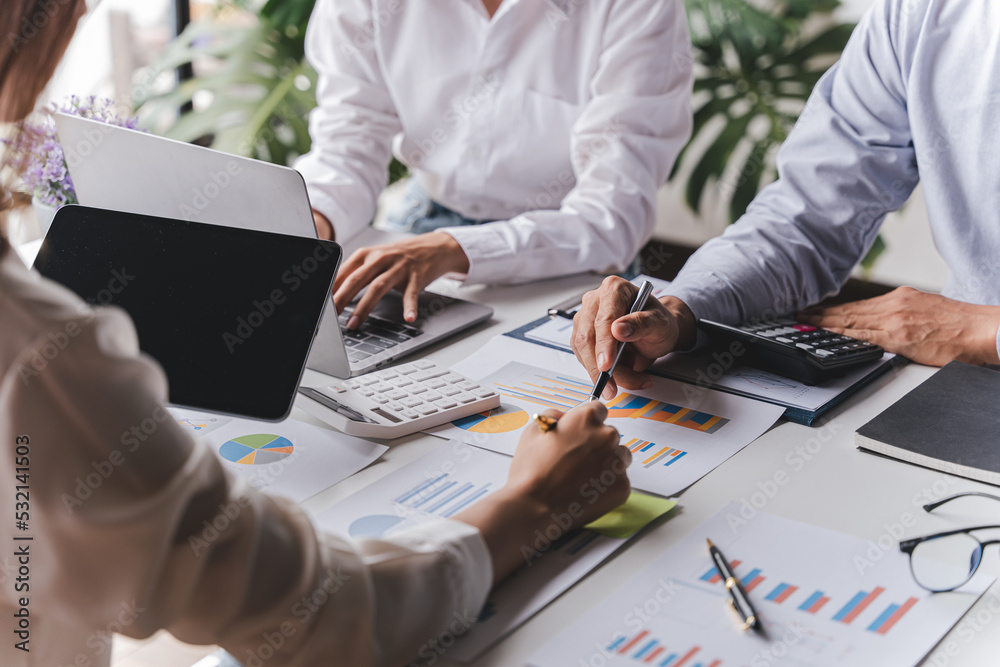 Young colleagues discuss business brainstorming and price charts ...