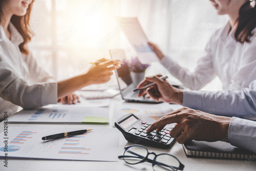 Young colleagues discuss business brainstorming and price charts ...