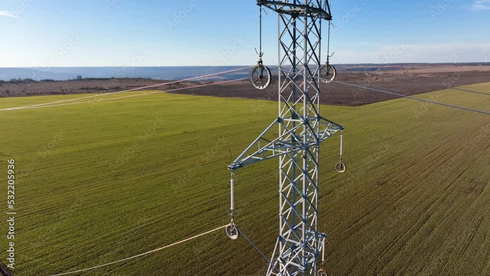 Aerial circling view of steel erector workers strengthen a newly ...