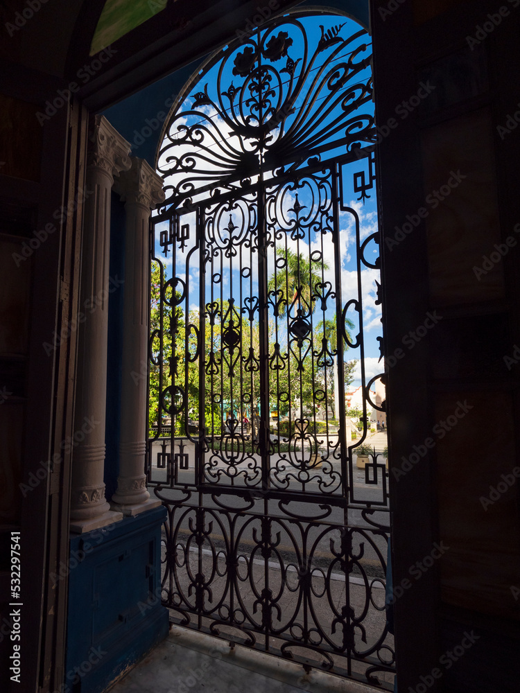 Cuba, Camaguey, UNESCO World Heritage Site, wrought iron grill in giant ...