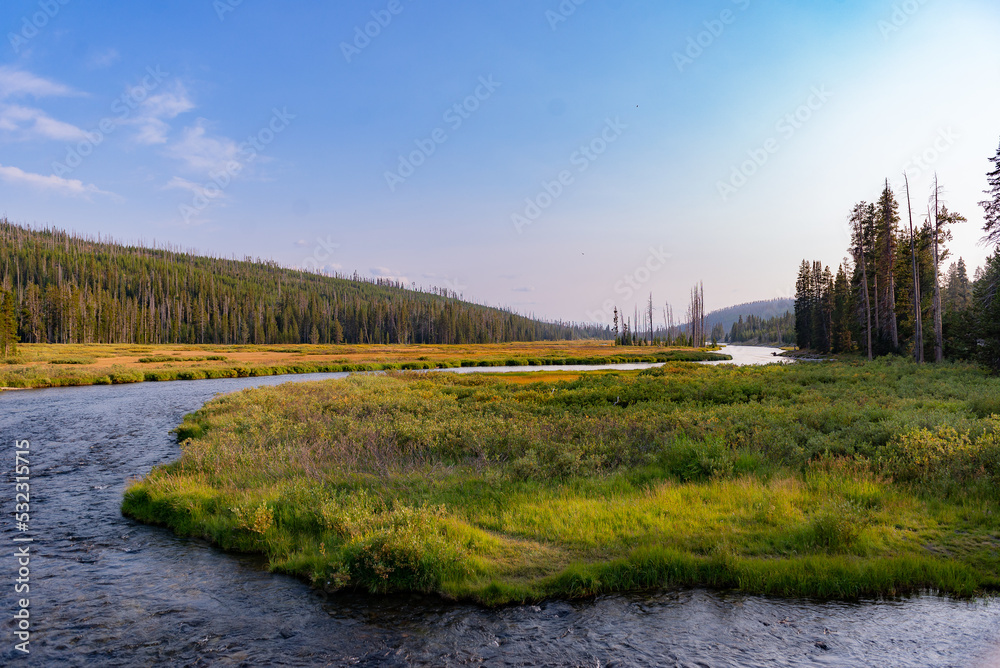 Curving River Around A Green Patch of Grass. Stock Photo | Adobe Stock