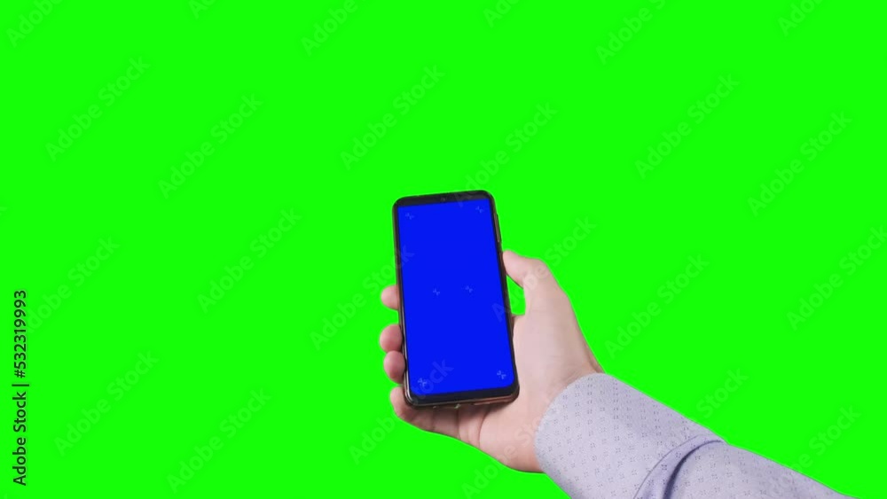 Male hand holding a smartphone with a blue screen and trackers on a ...