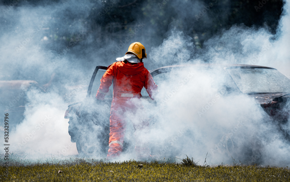 Firefighters man fire extinguisher to fighting with fire from oil and ...