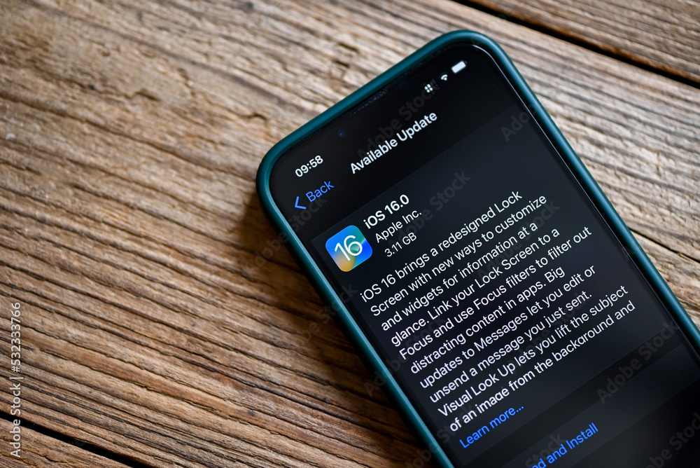iPhone with iOS 16 logo on the screen close up, new operating system ...
