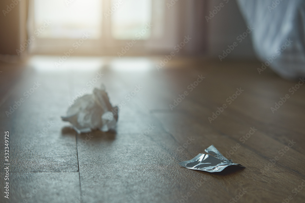 used condom package and tissue paper were left on the floor in the ...