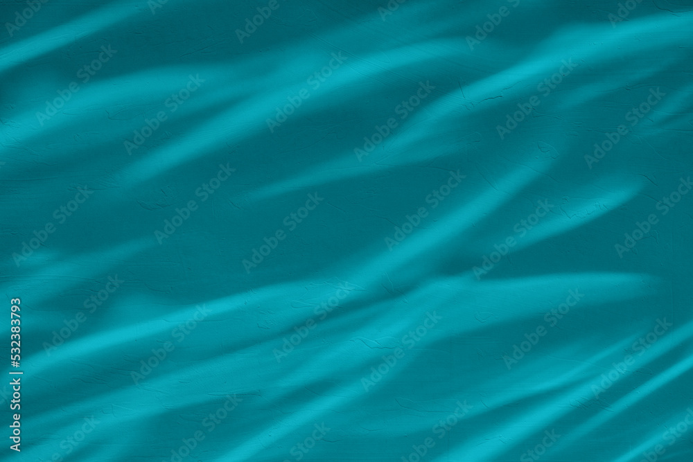 Shadow and light water caustic effect on blue concrete wall texture ...