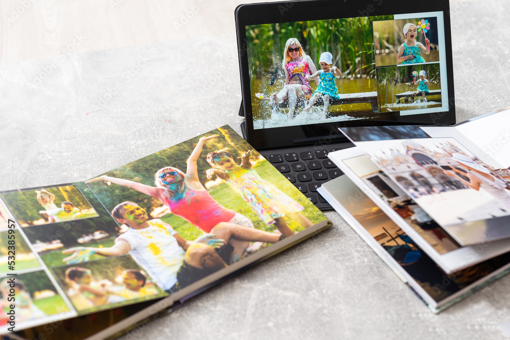 photobook album and tablet on the table Stock Photo | Adobe Stock