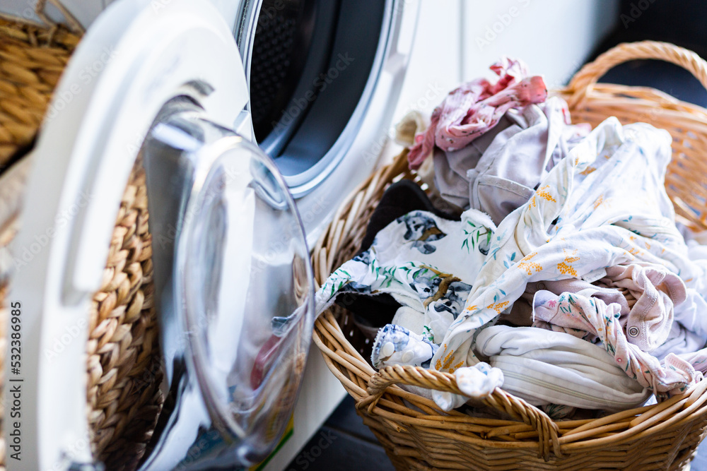 Basket of clean washed washing in laundry ready to be hung up to dry ...