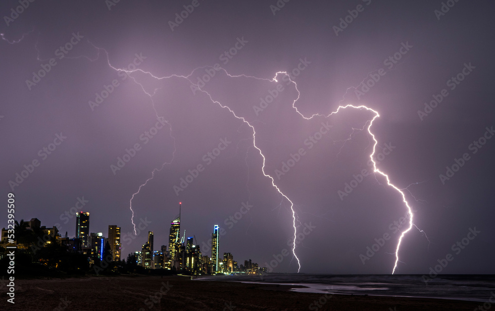 Lightning bolts across the night sky against the Gold Coast cityscape ...