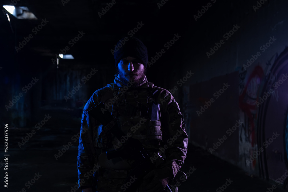 Army soldier in Combat Uniforms with an assault rifle and combat helmet ...
