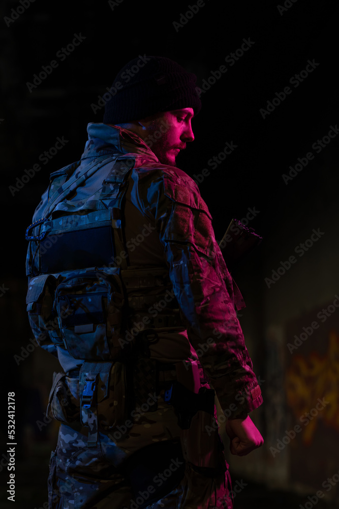 Army soldier in Combat Uniforms with an assault rifle and combat helmet ...