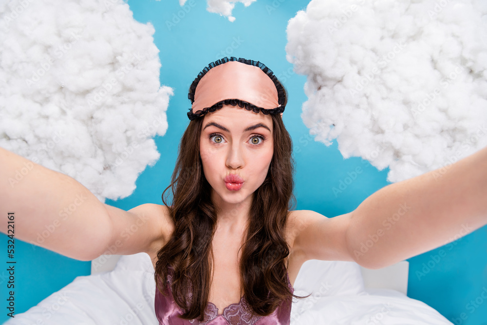 Self-portrait of beautiful trendy girl sitting in bed relax sleepover ...