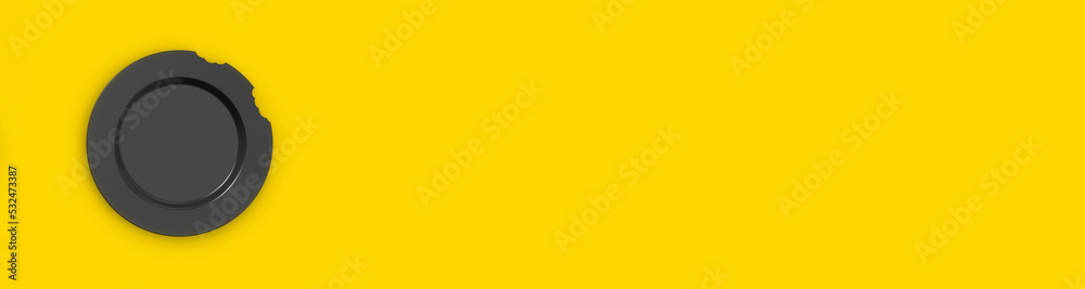 bitten black plate on a yellow background. Teeth marks. Food crisis ...