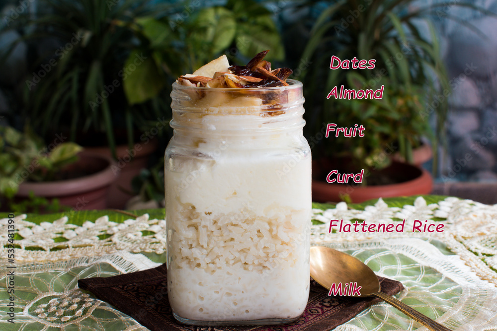Healthy Indian breakfast cereal Flattened rice, curd, fruit, nut. Yummy ...