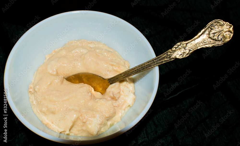 Mishti Doi or sweet dahi or curd made with milk and sugar or jaggery in ...