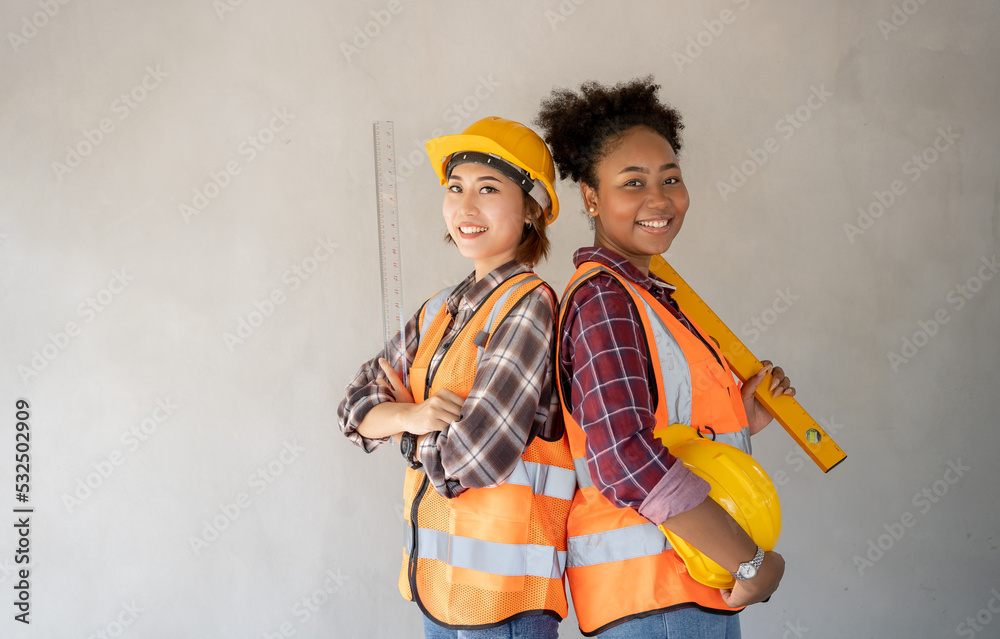 Happy group of working men at a construction site.Diversity job working ...