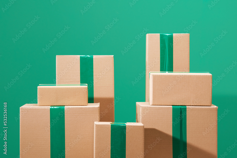 Lots of cardboard boxes on a color background Stock Photo | Adobe Stock