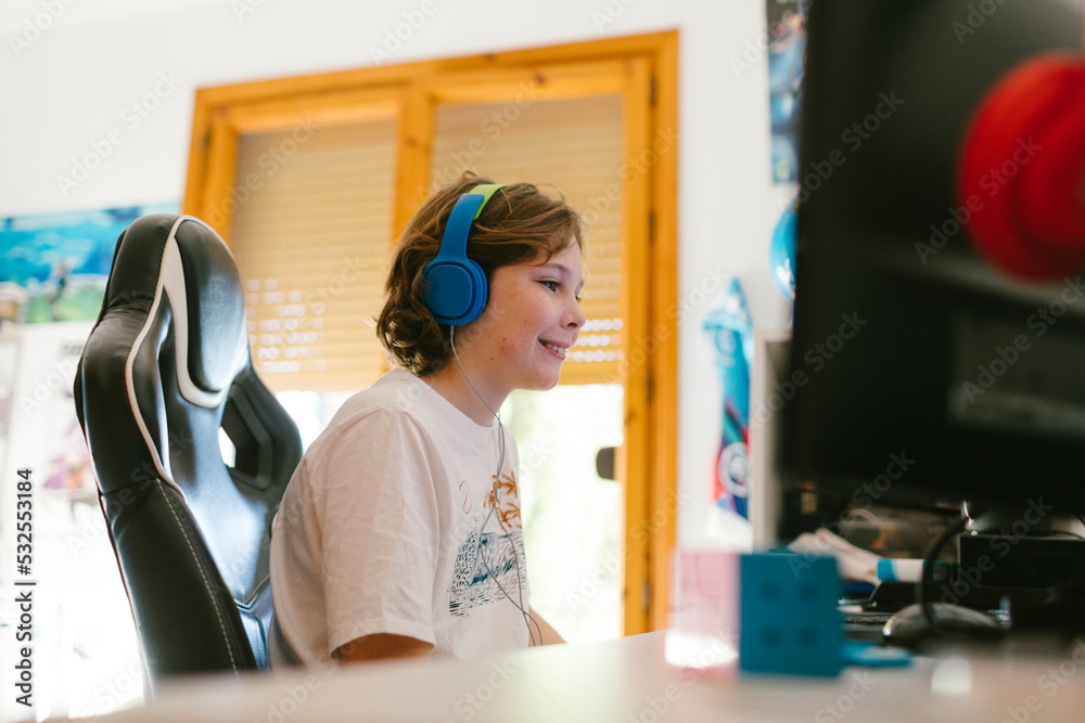 Teen boy playing video games Stock Photo | Adobe Stock