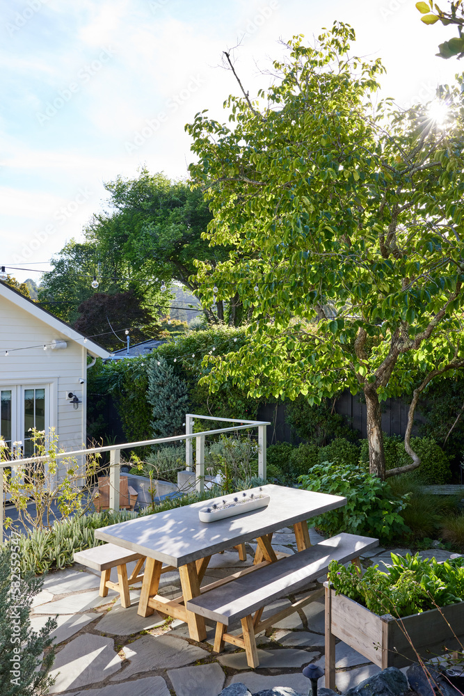 Exterior backyard picnic table in modern farmhouse home Stock Photo ...