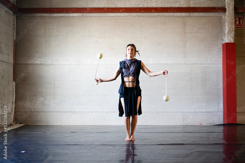 Juggler with poi balls Stock Photo | Adobe Stock