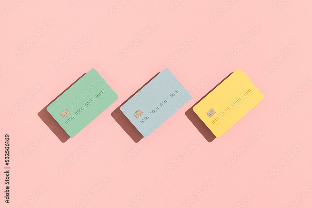 Pastel credit / debit cards on pink background Stock Photo | Adobe Stock