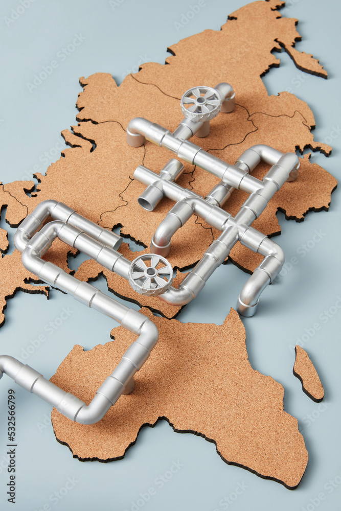 Gas piping over cork world map. Stock Photo | Adobe Stock