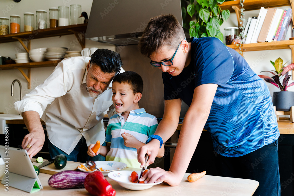 Father And Sons Cooking Together. Stock Photo | Adobe Stock