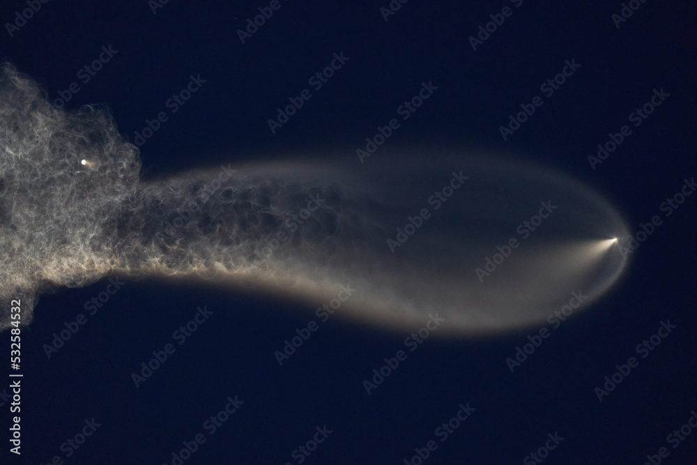 A rocket launches into space with a vapor tail in Florida Stock Photo ...
