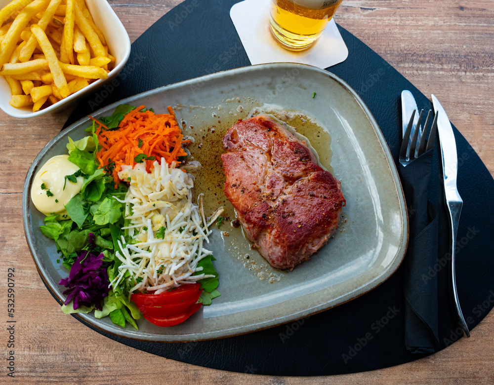Traditional Belgian grilled pork steak varkens cote de los served with ...