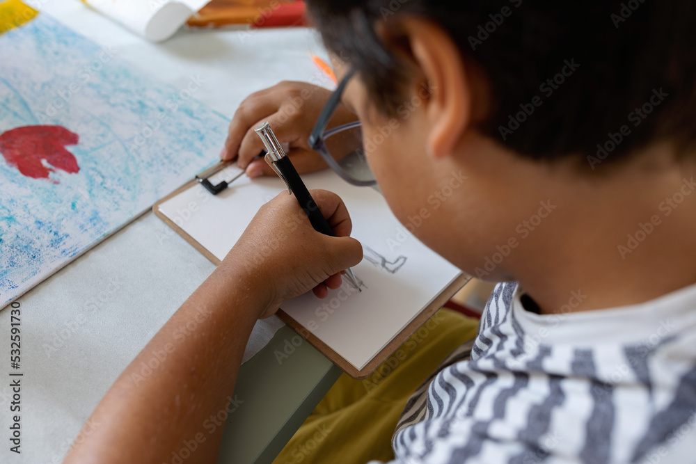 kid drawing a sketch Stock Photo | Adobe Stock