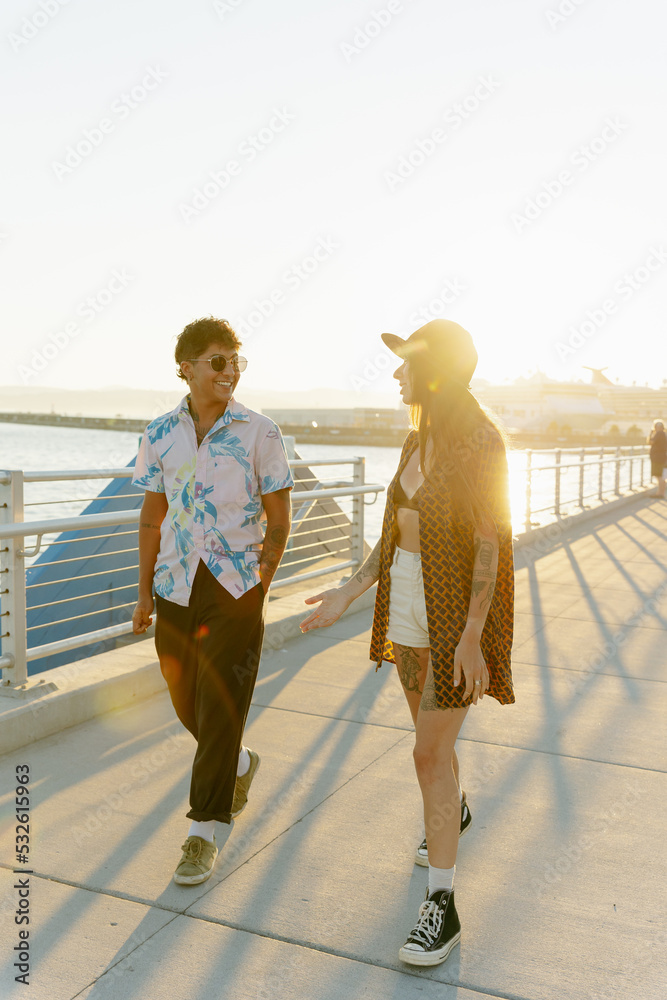 Two friends walk along the beach Stock-Foto | Adobe Stock