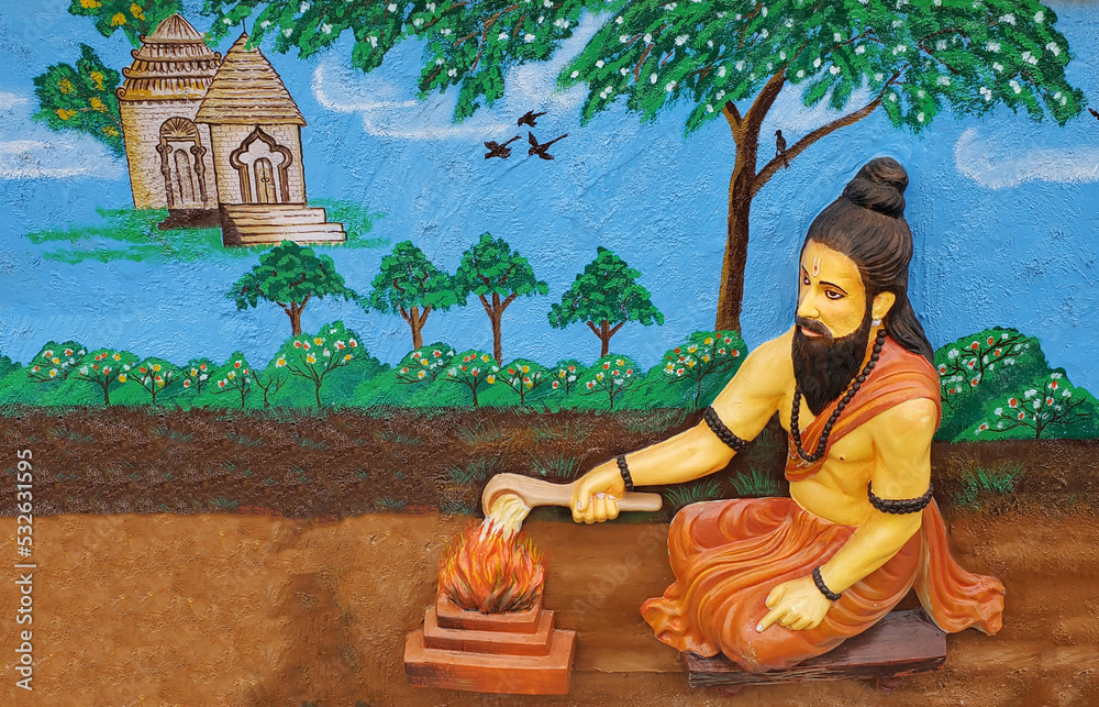 Indian Hindu sadhu performing prayers or pooja wall art in a temple ...