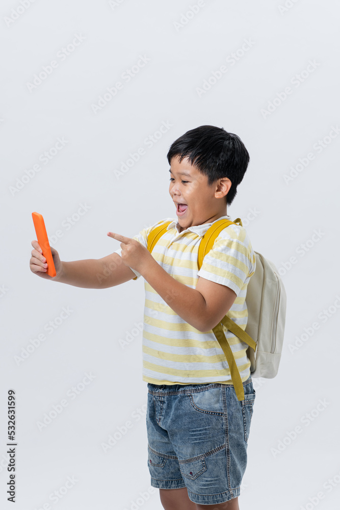 Excited boy smiling and poiting at screen on smartphone. Stock Photo ...