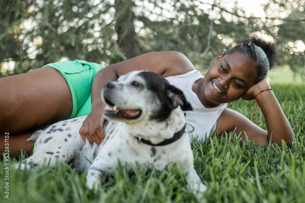 young black woman with her dog in nature Stock Photo | Adobe Stock