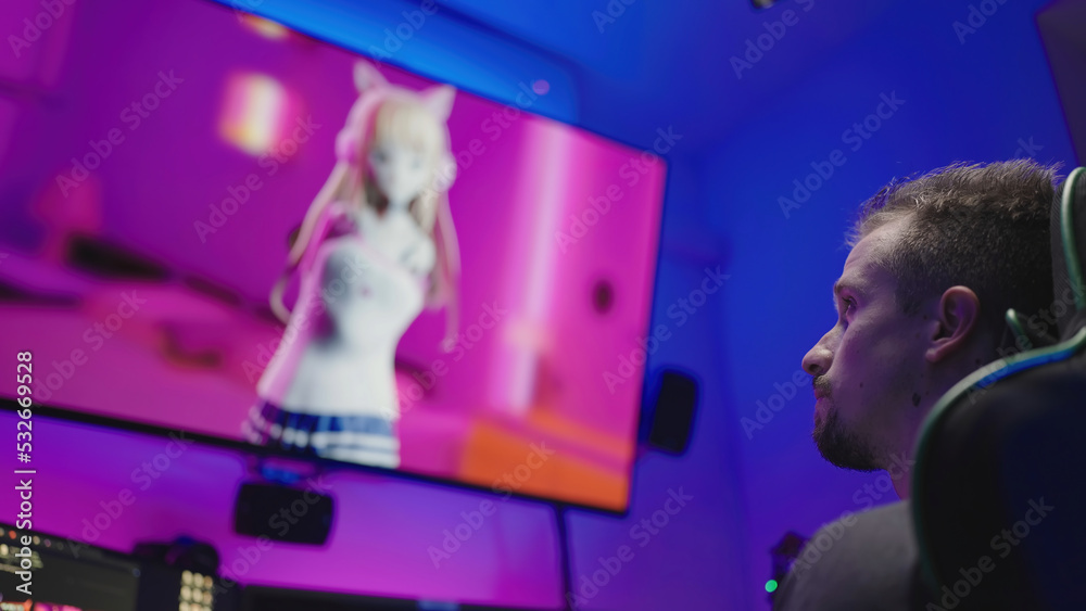 Male weeb absorbed in watching anime girl on big TV from gaming chair ...