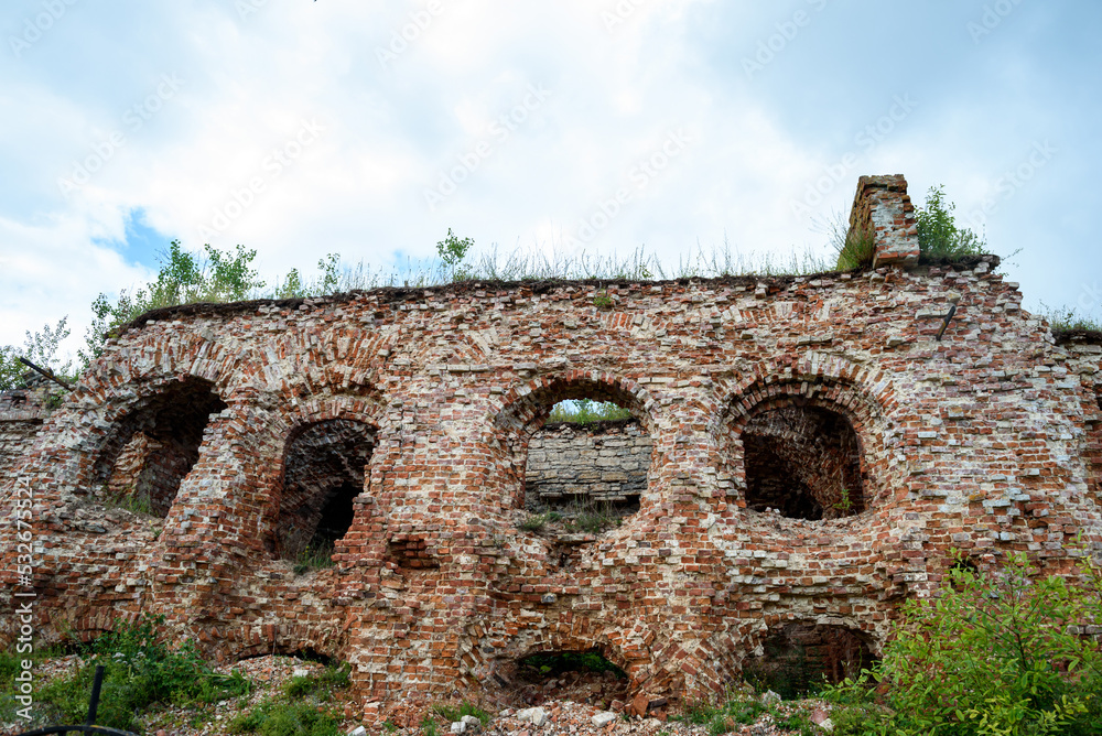 Abandoned ruins of old historical fortress against bright blue sky ...