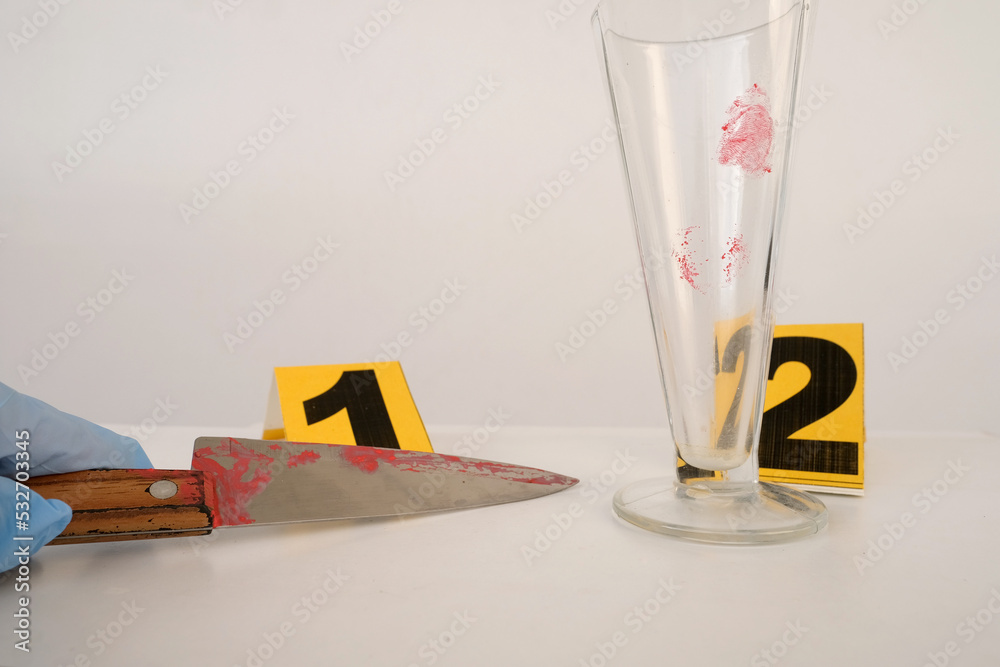crime scene with evidence markers, idfresh splatter of red blood on ...