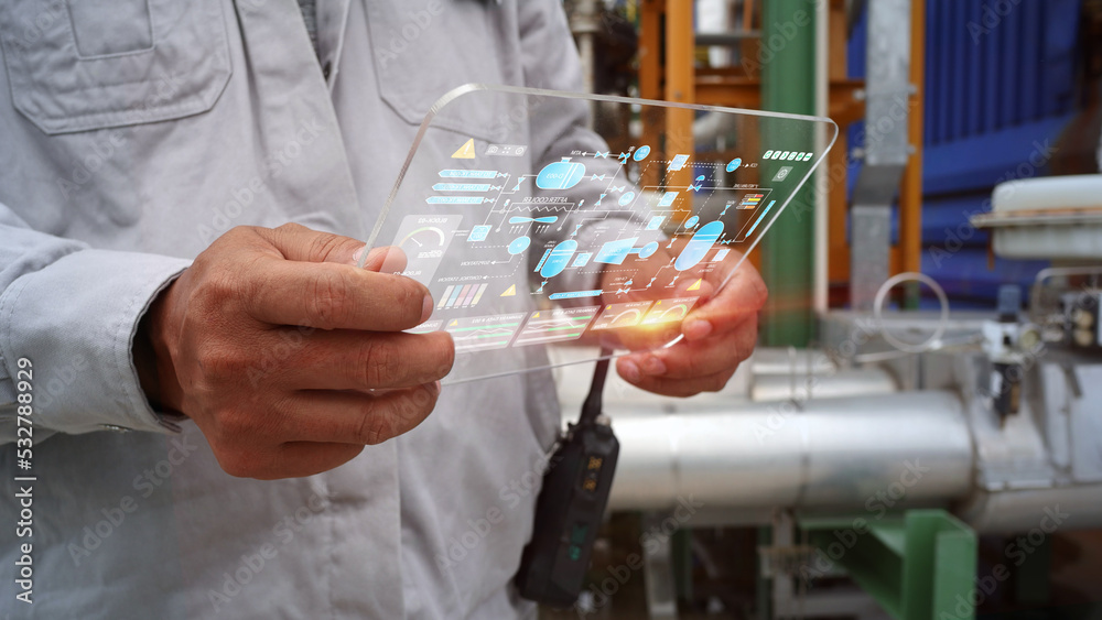 Engineers are inspecting manufacturing processes, reading holographic ...