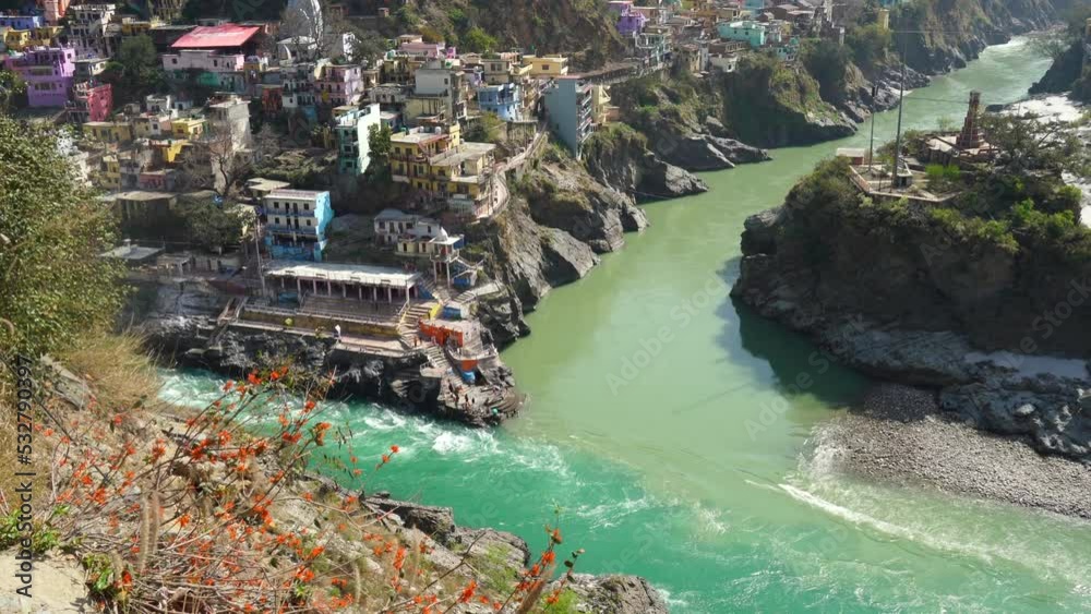 Confluence of muddy colored Alakananda and green colored Bhagirathi ...