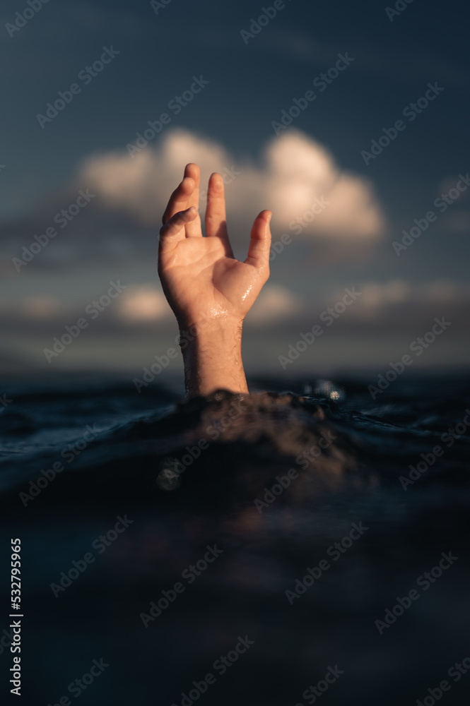 Hand Reaching Out Of Water
