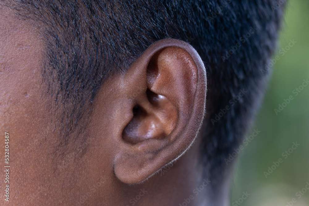 Human Ear - Close up of a man's ear Its body part helps to hear sound ...